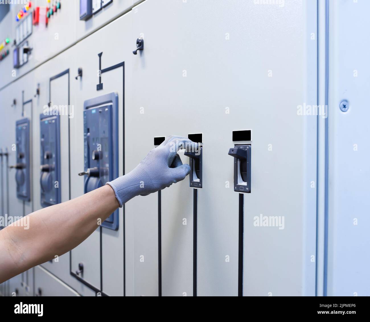 Electrical engineer checking the operation of electrical control ...