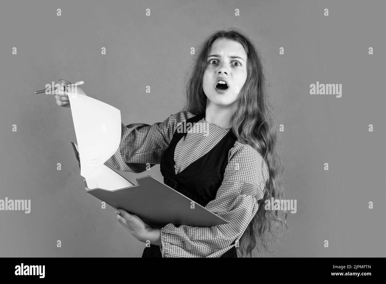 surprised teen girl hold paper document folder, work Stock Photo - Alamy