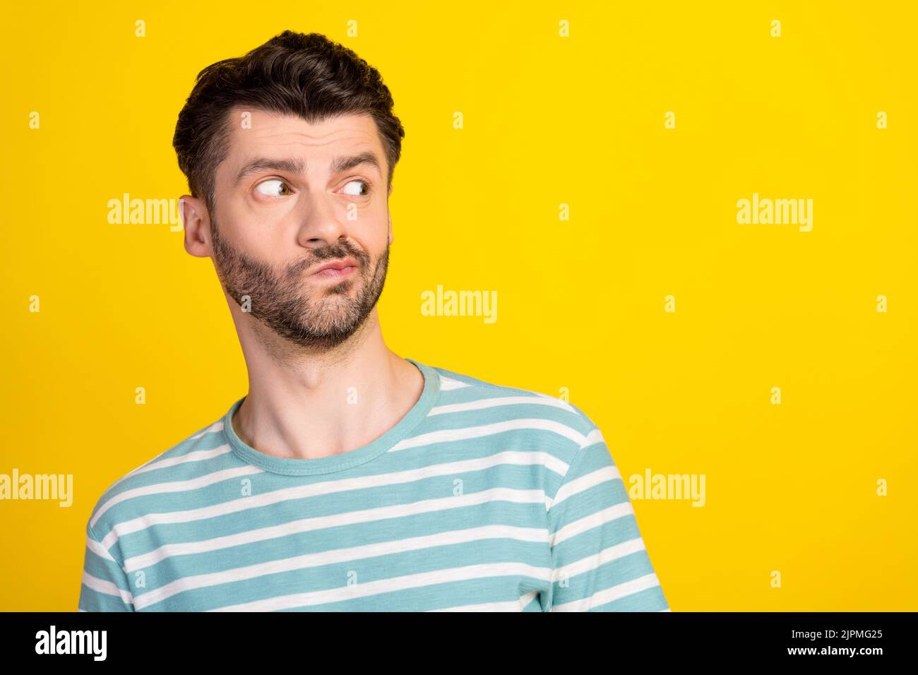 Closeup photo of young handsome funny guy grimace suspicious look empty ...