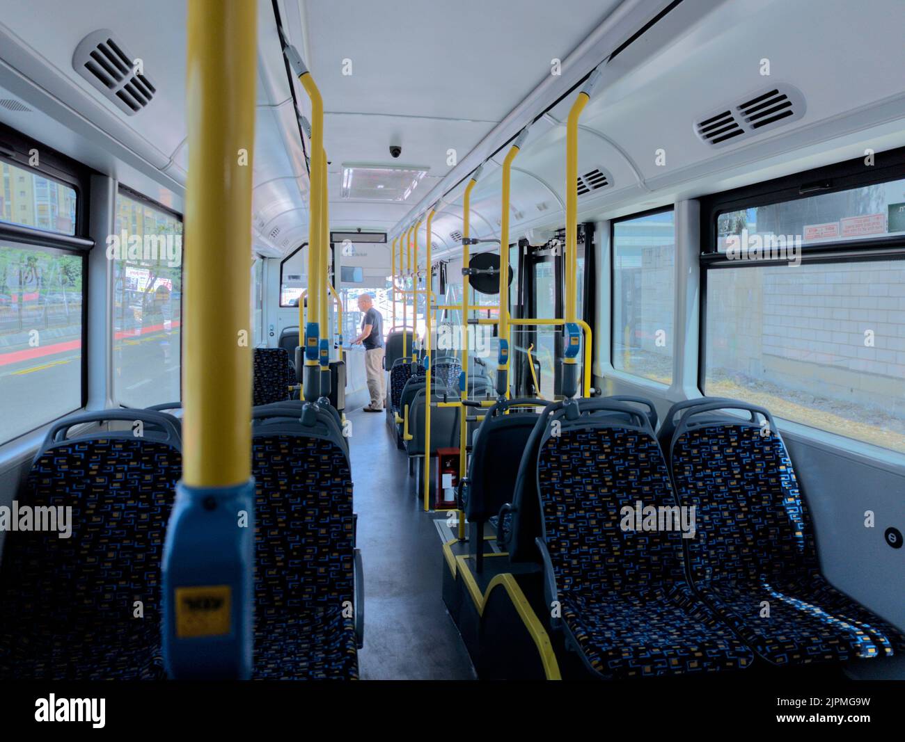 An empty bus is occupied by a man Stock Photo - Alamy