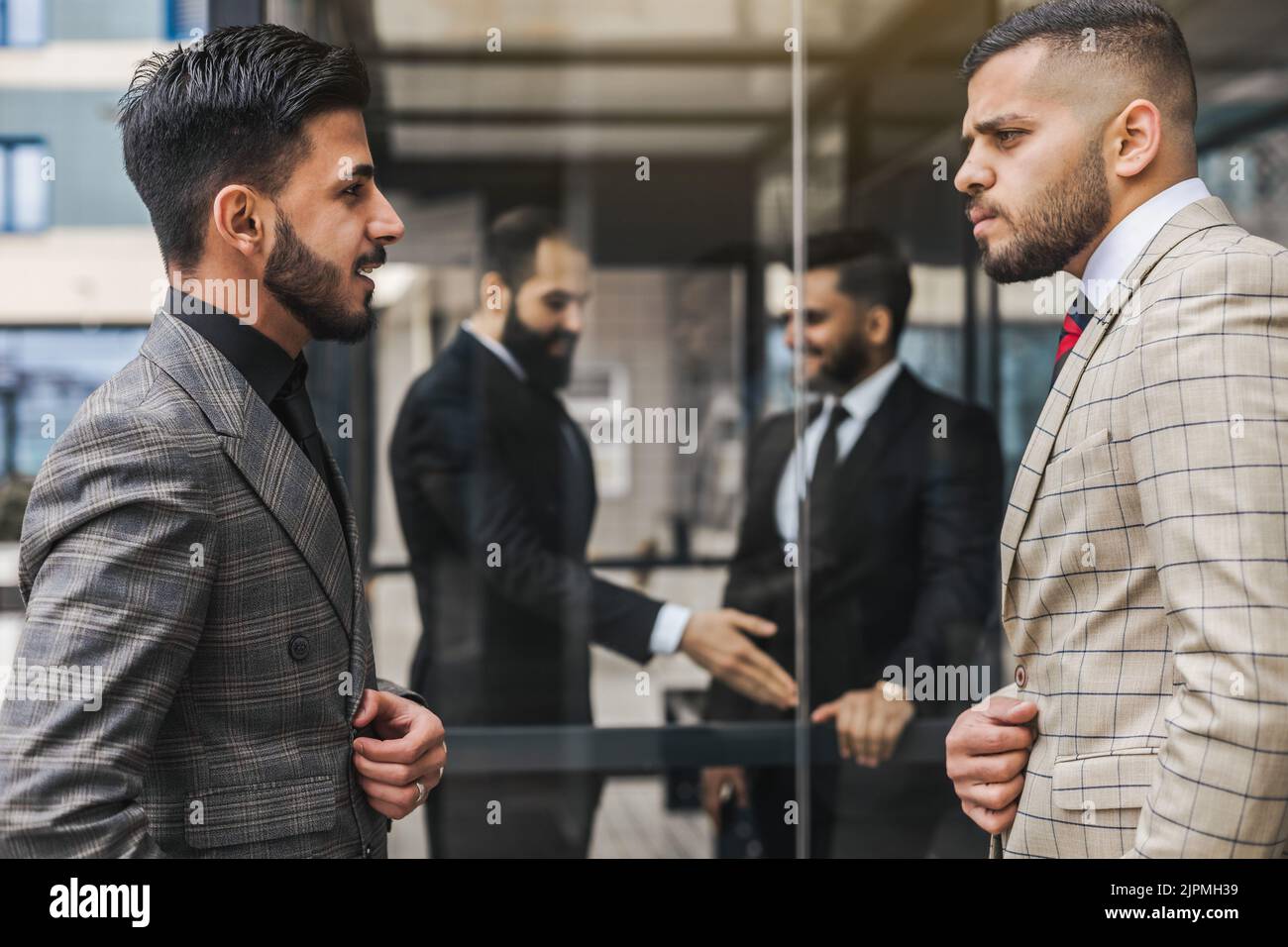 Business people outdoor meeting. Men in jackets discuss working moments ...
