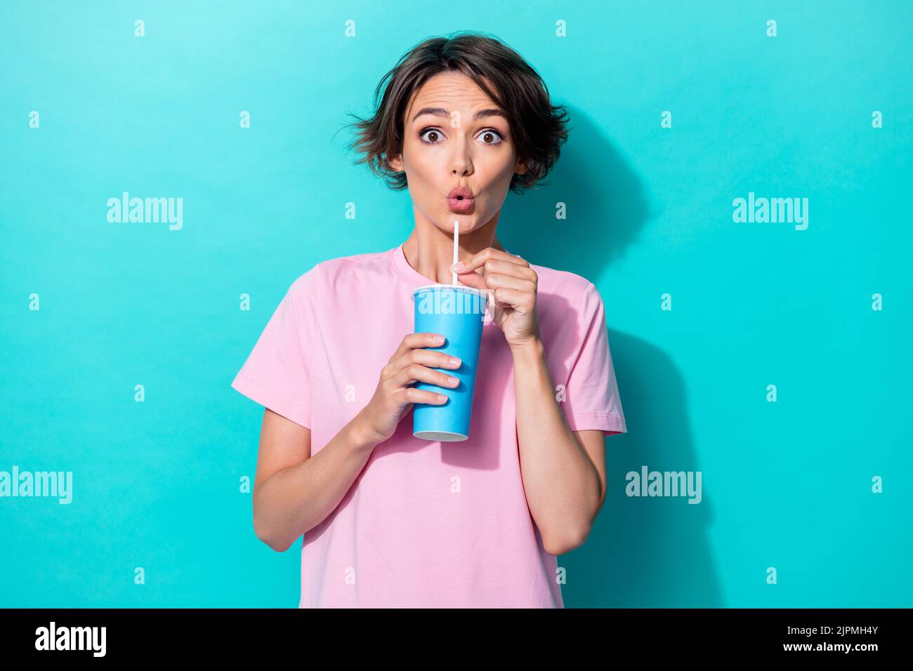 Photo of young attractive funny cute woman hold blue cola drinking ...