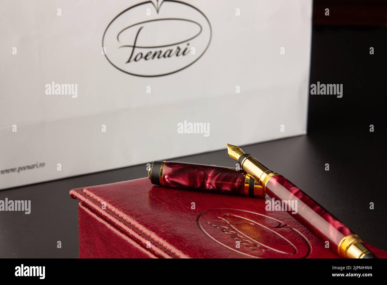 An old ink pen on a vintage box on a table Stock Photo - Alamy