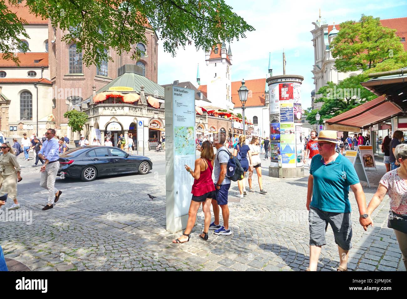 People at the Munich Viktualienmarkt. Munich's most famous permanent ...