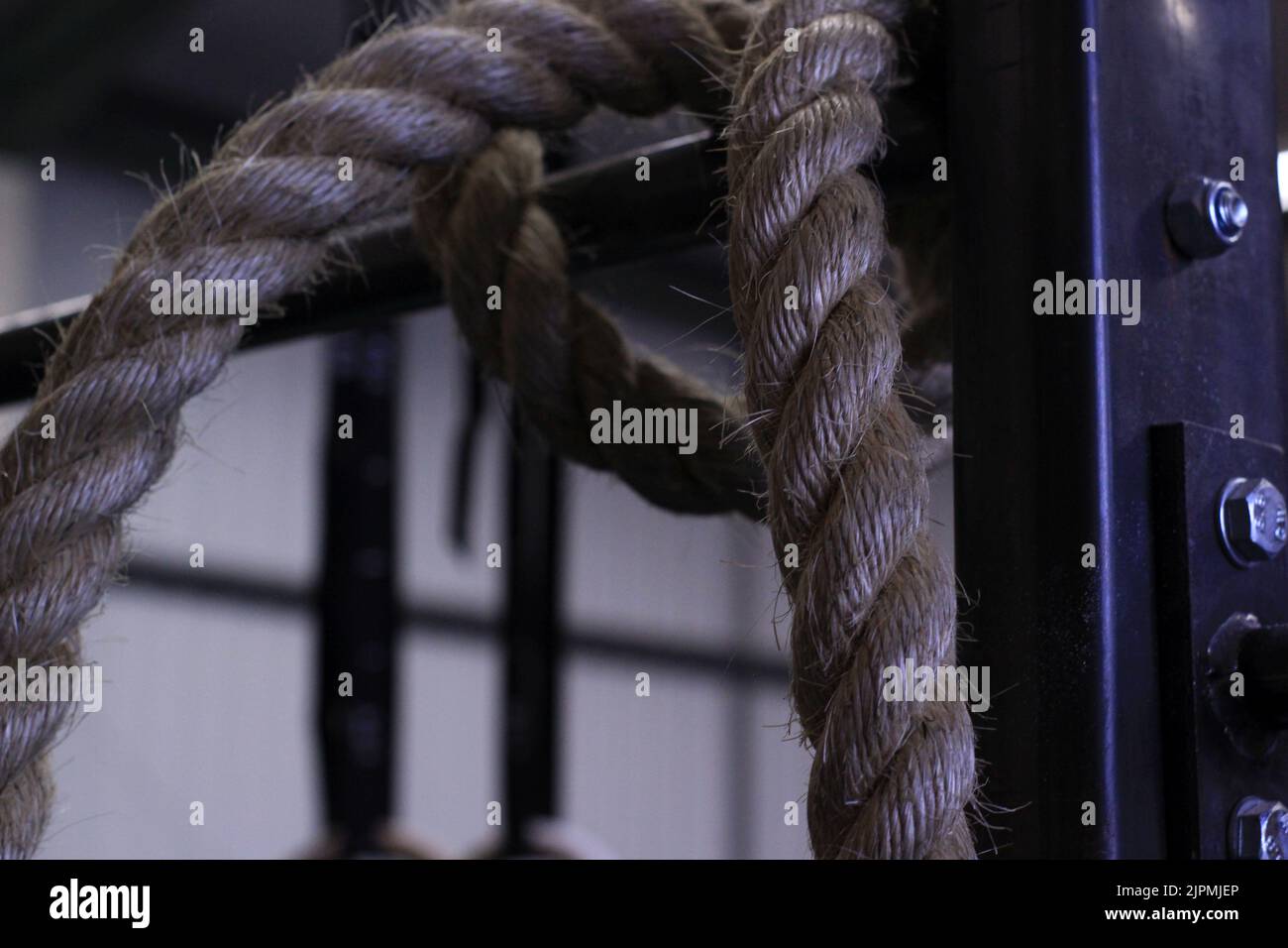 Hanging off rope hi-res stock photography and images - Alamy