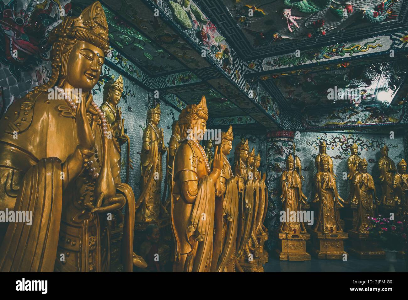 Numerous golden buddhist statues inside Linh Phuoc Pagoda in Da lat ...