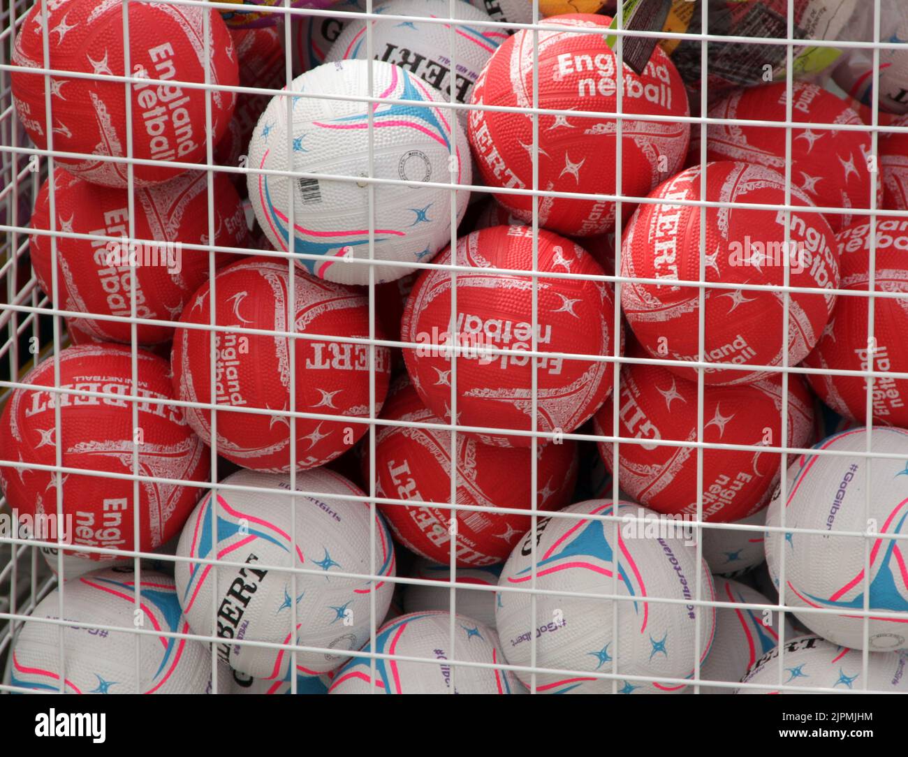 Mini Gilbert Netballs in a cage Stock Photo - Alamy