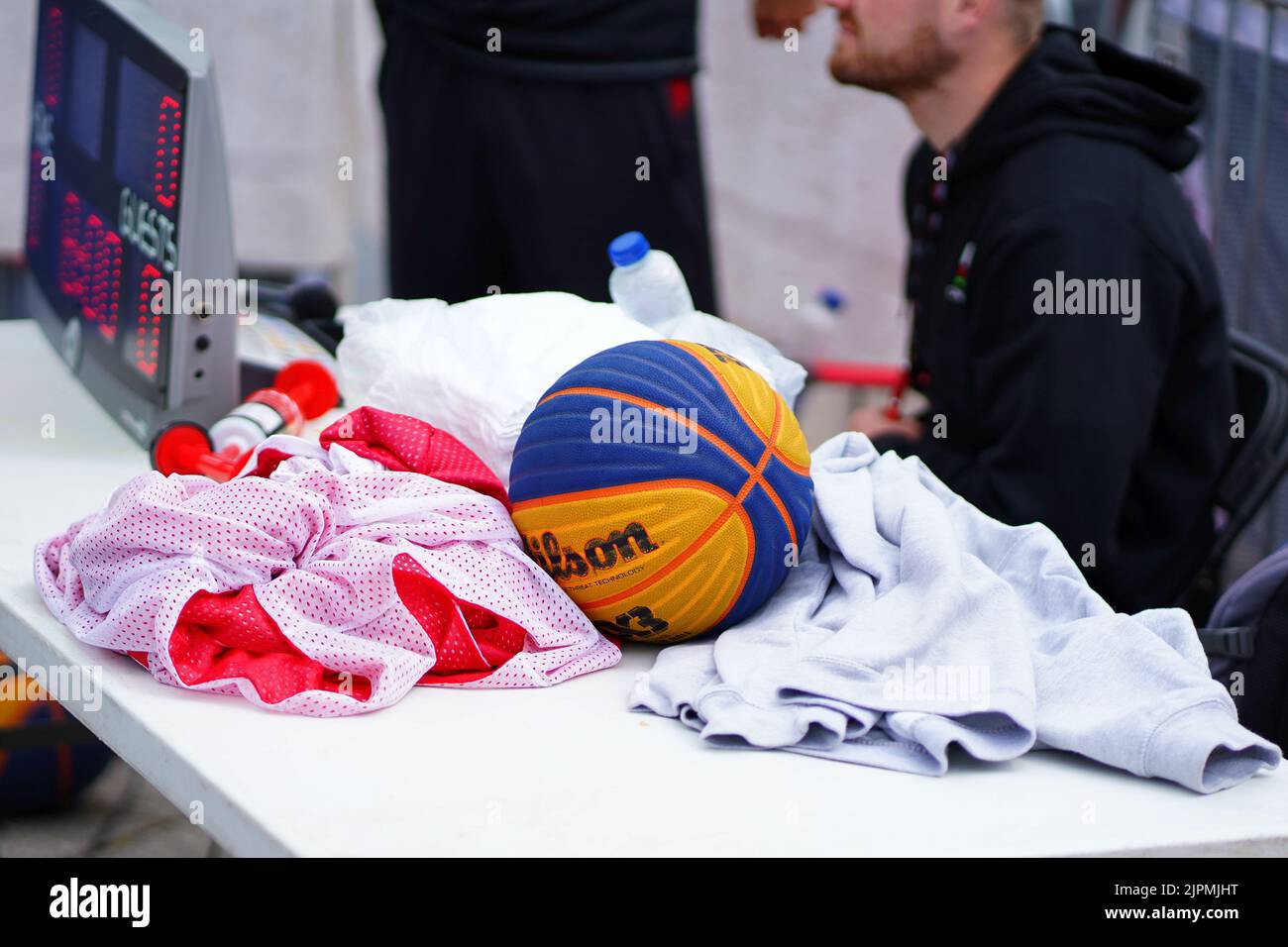 Blue and Yellow Wilson basketball sat on a scoring desk Stock Photo - Alamy