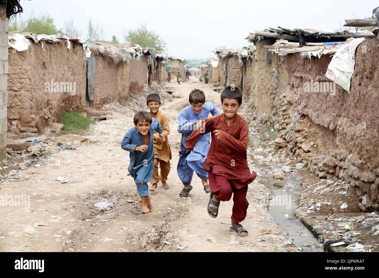 Islamabad, Pakistan. 18th Aug, 2022. Afghan refugee children play at a ...