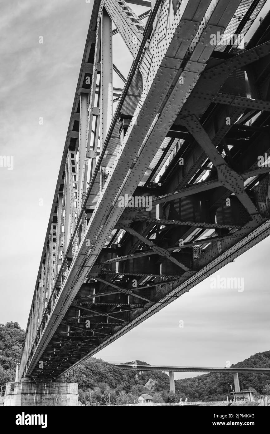A vertical low-angle shot of a beautiful bridge in grayscale Stock ...