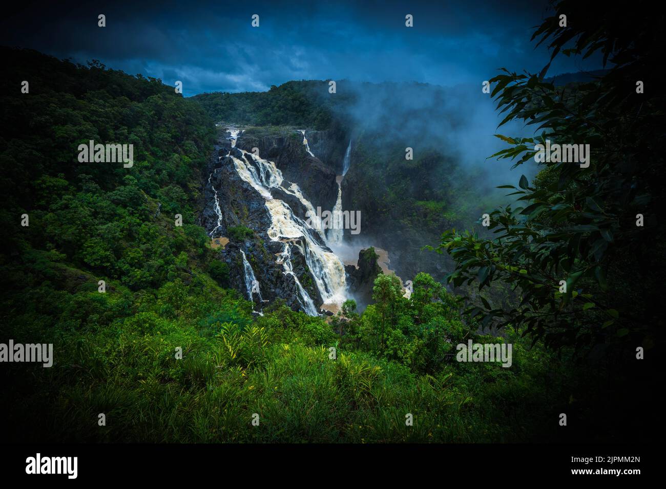 A beautiful scenic view of Barron Falls waterfall surrounded by green ...