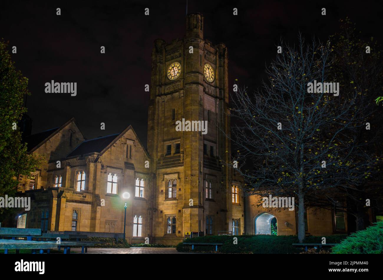 The Clock tower of the University of Melbourne with lights on during ...