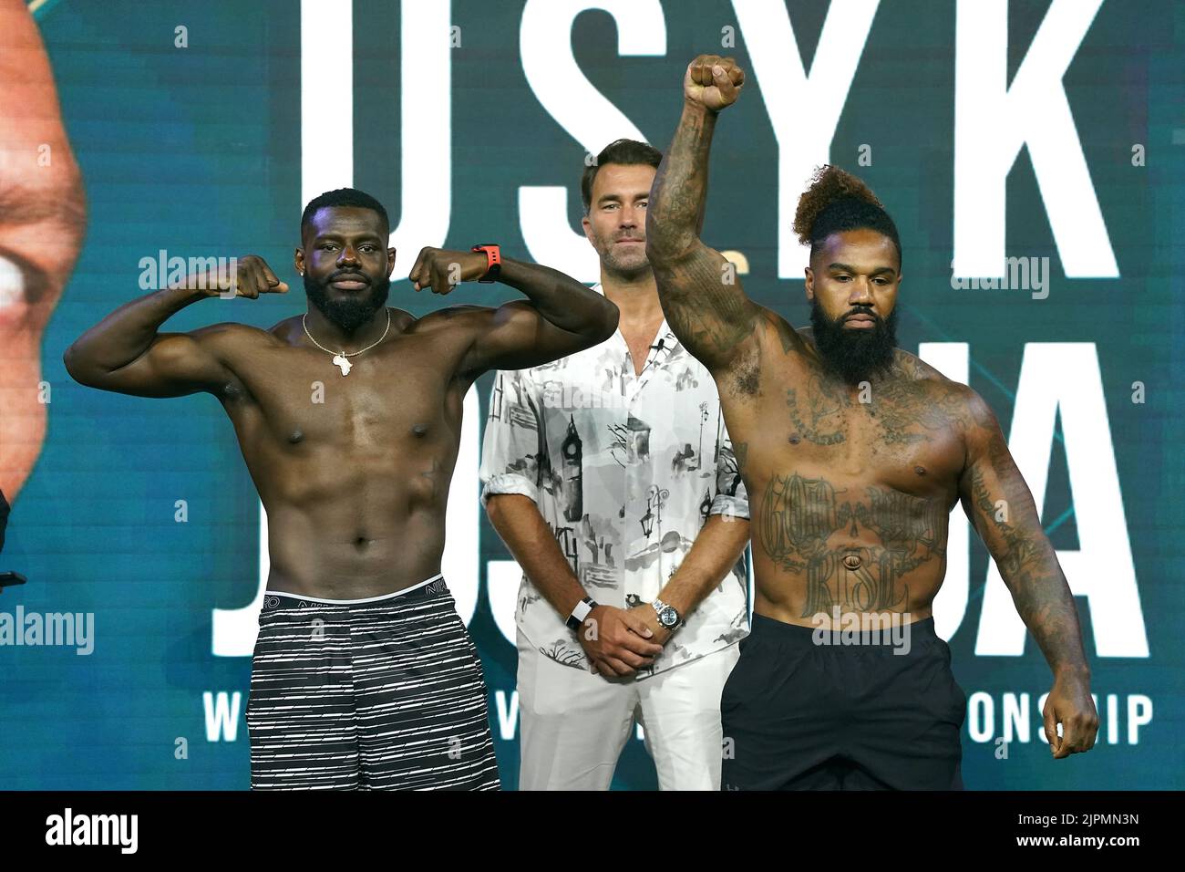 Andrew Tabiti (left) and James Wilson (right) with boxing promotor ...