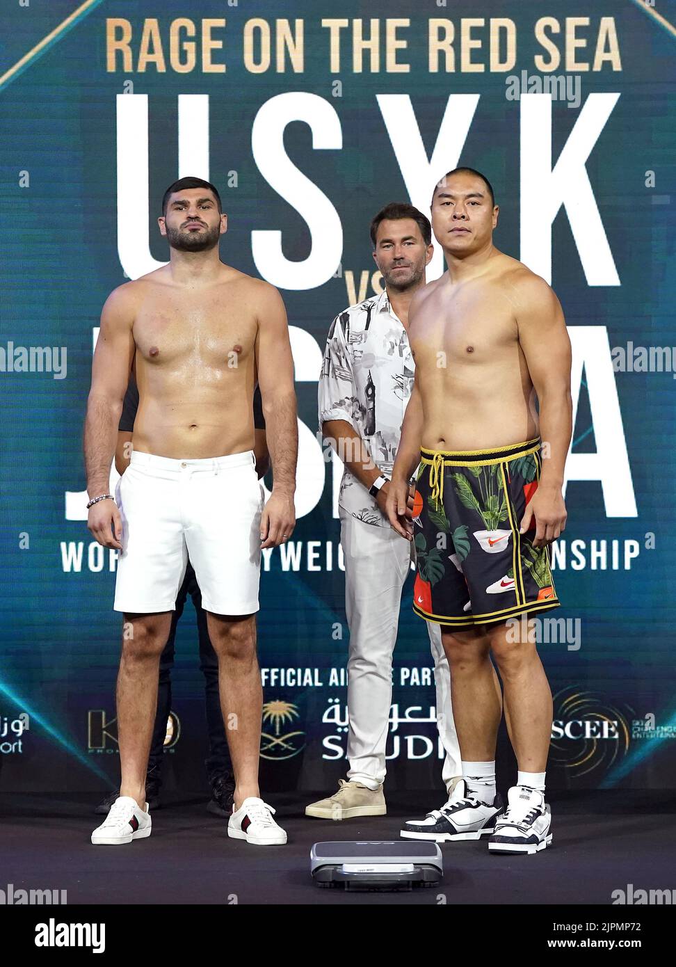 Filip Hrgovic (left) and Zhang Zhilei with boxing promotor Eddie Hearn ...