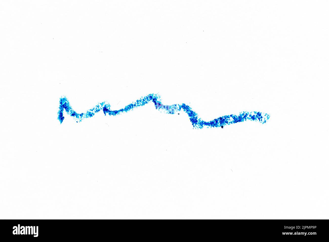 Blue color crayon hand drawing in sribble line shape on white paper ...