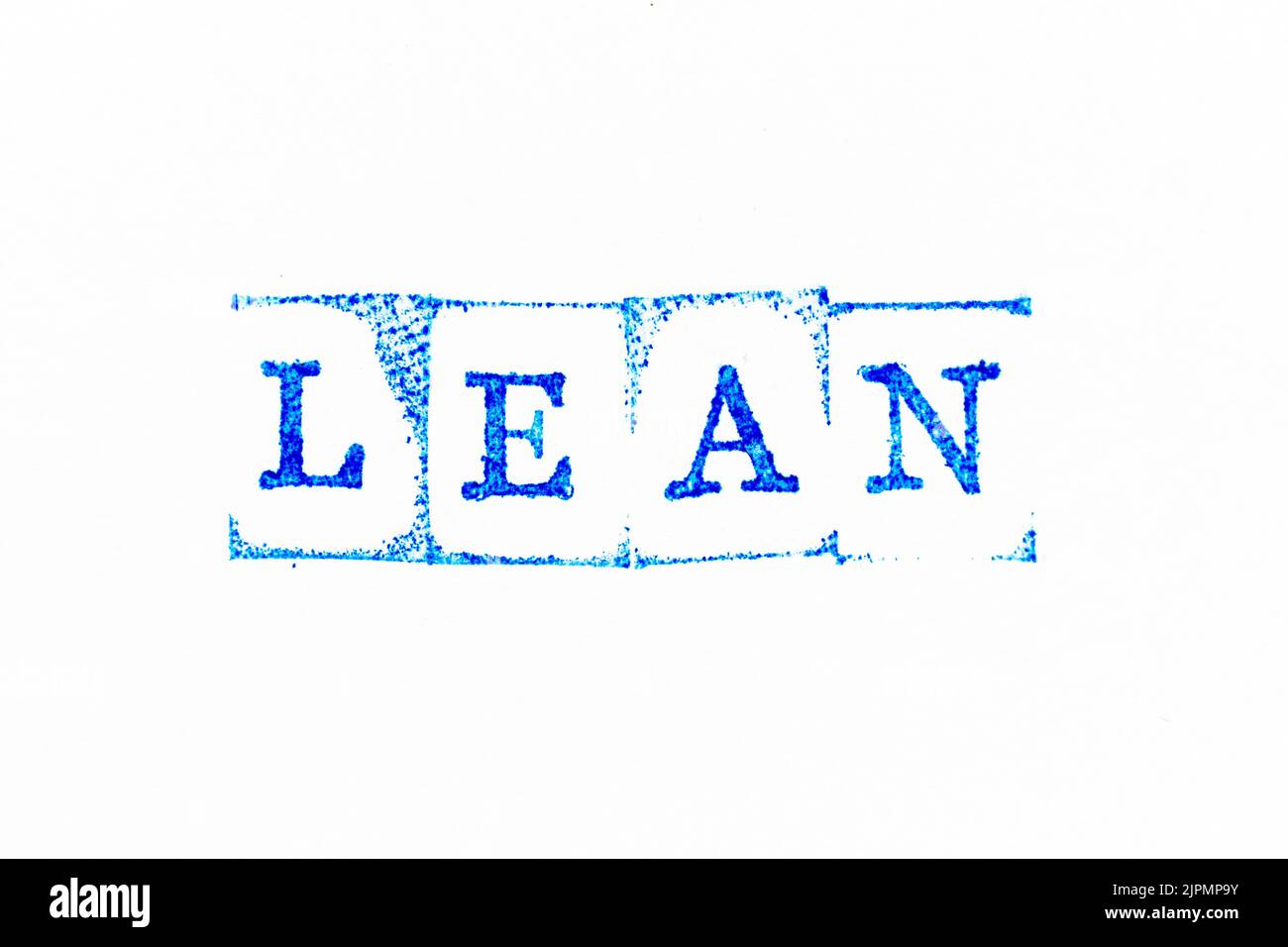 Blue color ink rubber stamp in word lean on white paper background ...