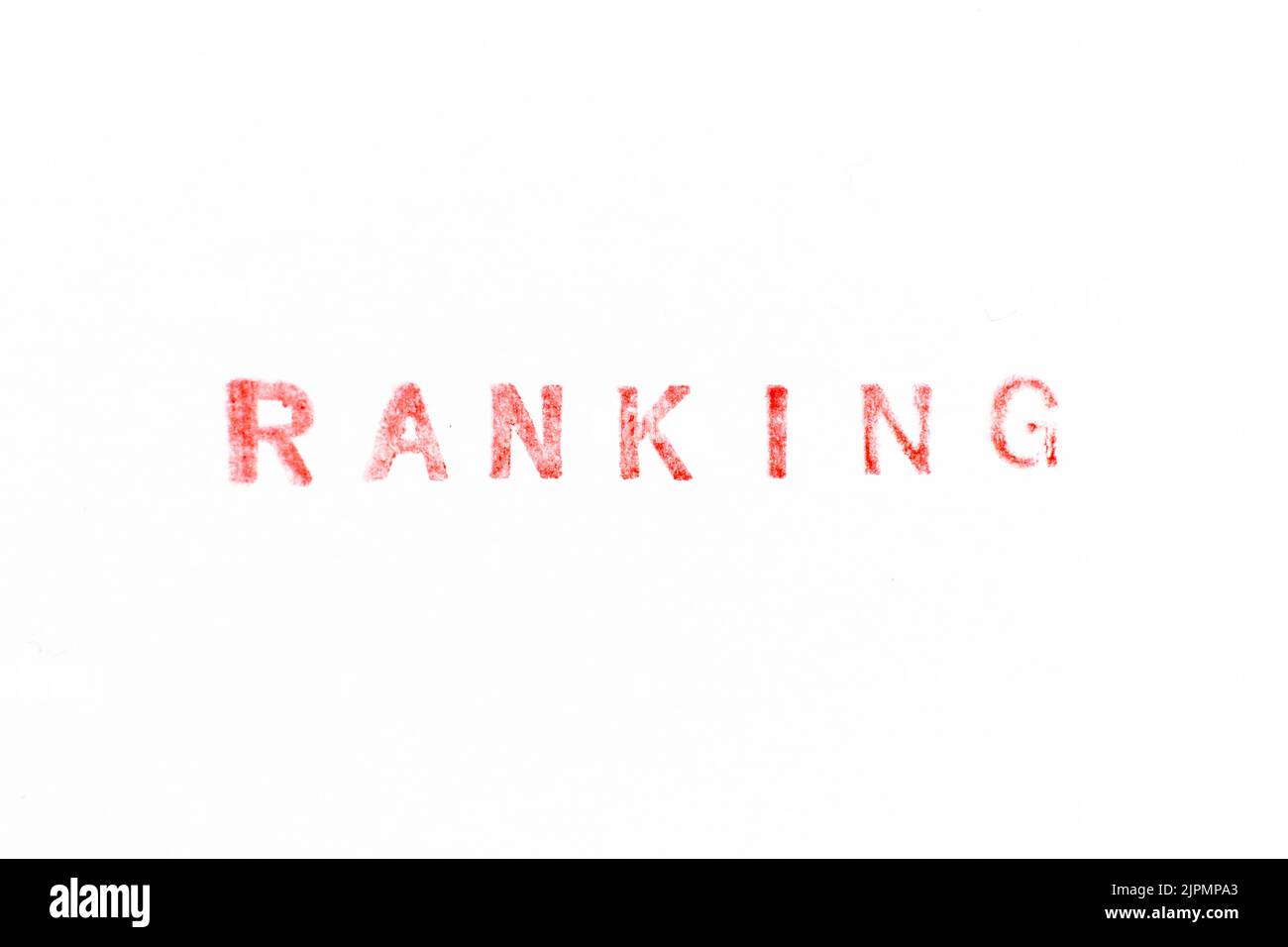 Red color ink rubber stamp in word ranking on white paper background ...
