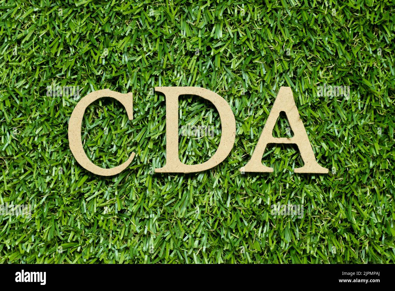 Wood alphabet letter in word CDA (Abbreviation of Confidential ...