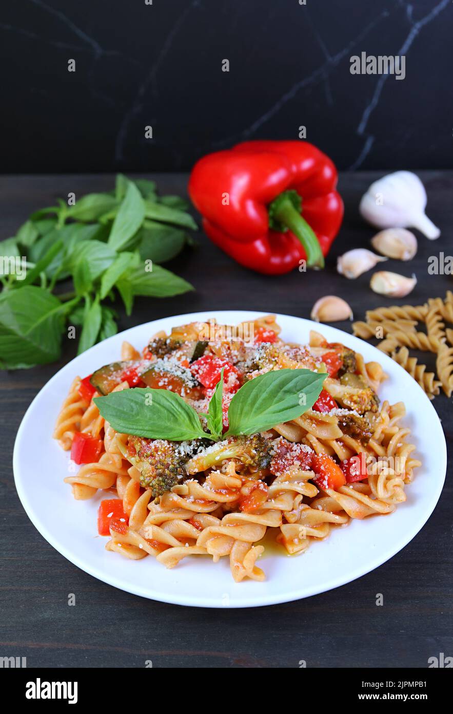 A Plate of Freshly Cooked Wholemeal Fusilli Pasta in Tomato Sauce on ...