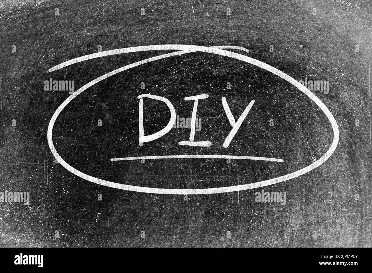 White chalk hand writing in word DIY (abbreviation of do it yourself ...