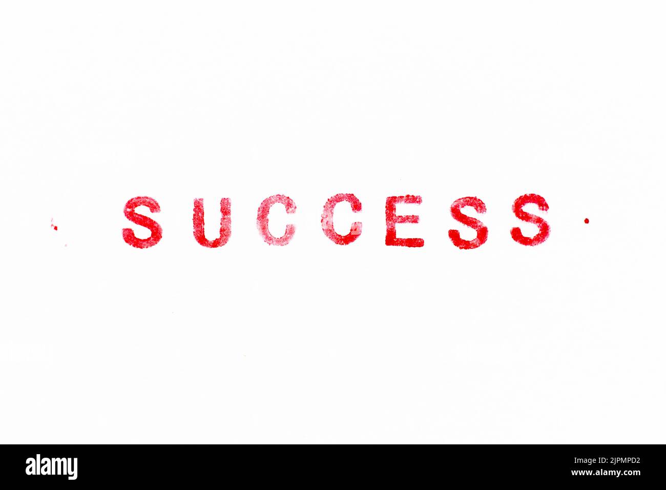 Red color ink rubber stamp in word success on white paper background ...