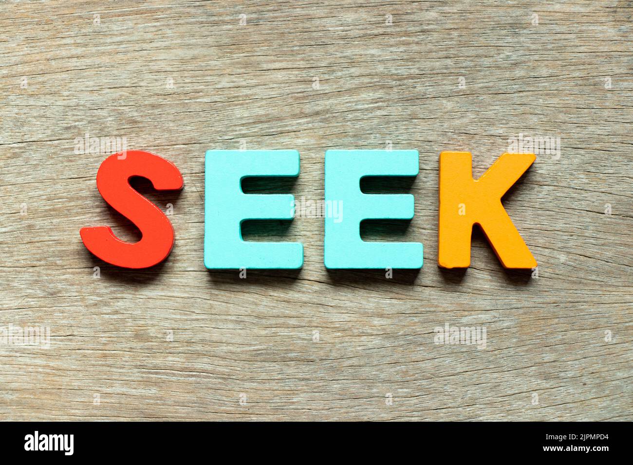 Color alphabet letter in word seek on wood background Stock Photo - Alamy