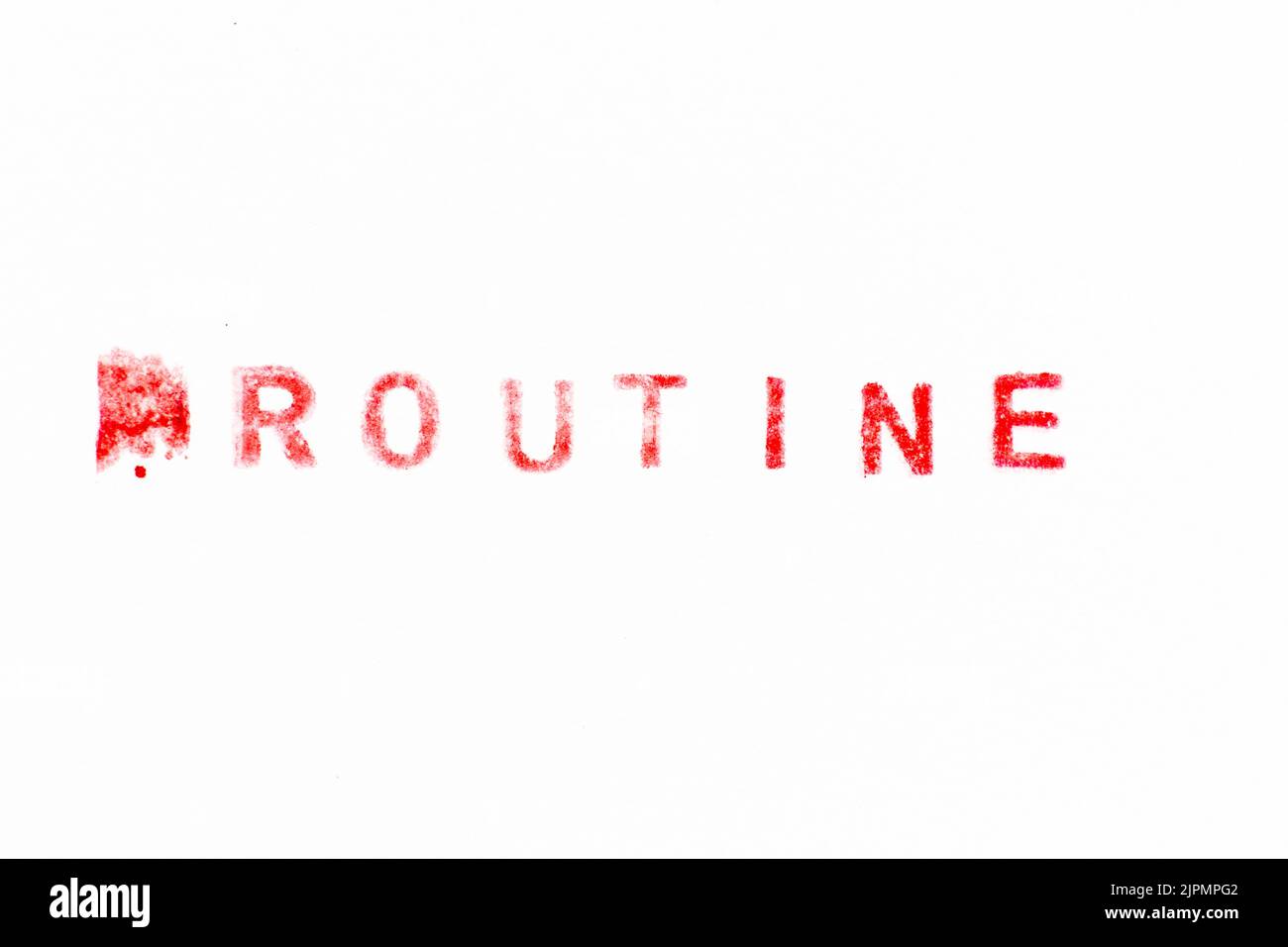 Red color ink rubber stamp in word routine on white paper background ...