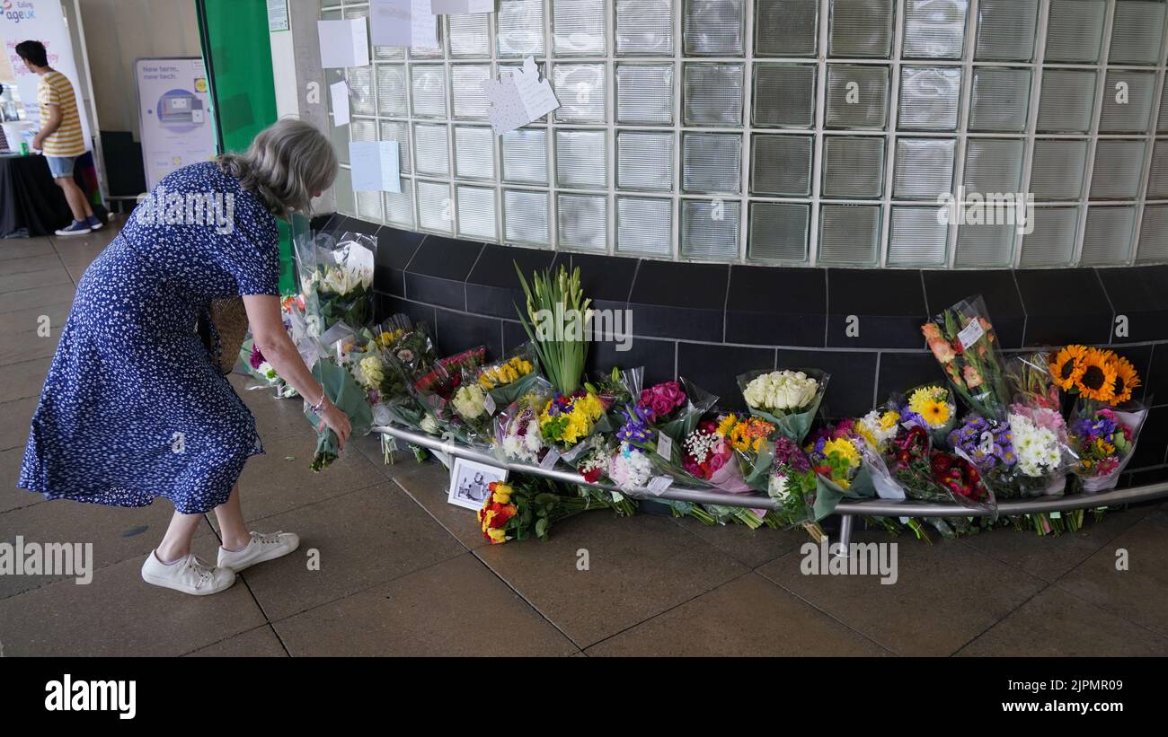 A lady leaves flowers outside Perivale Tesco, Greenford, where 87-year ...