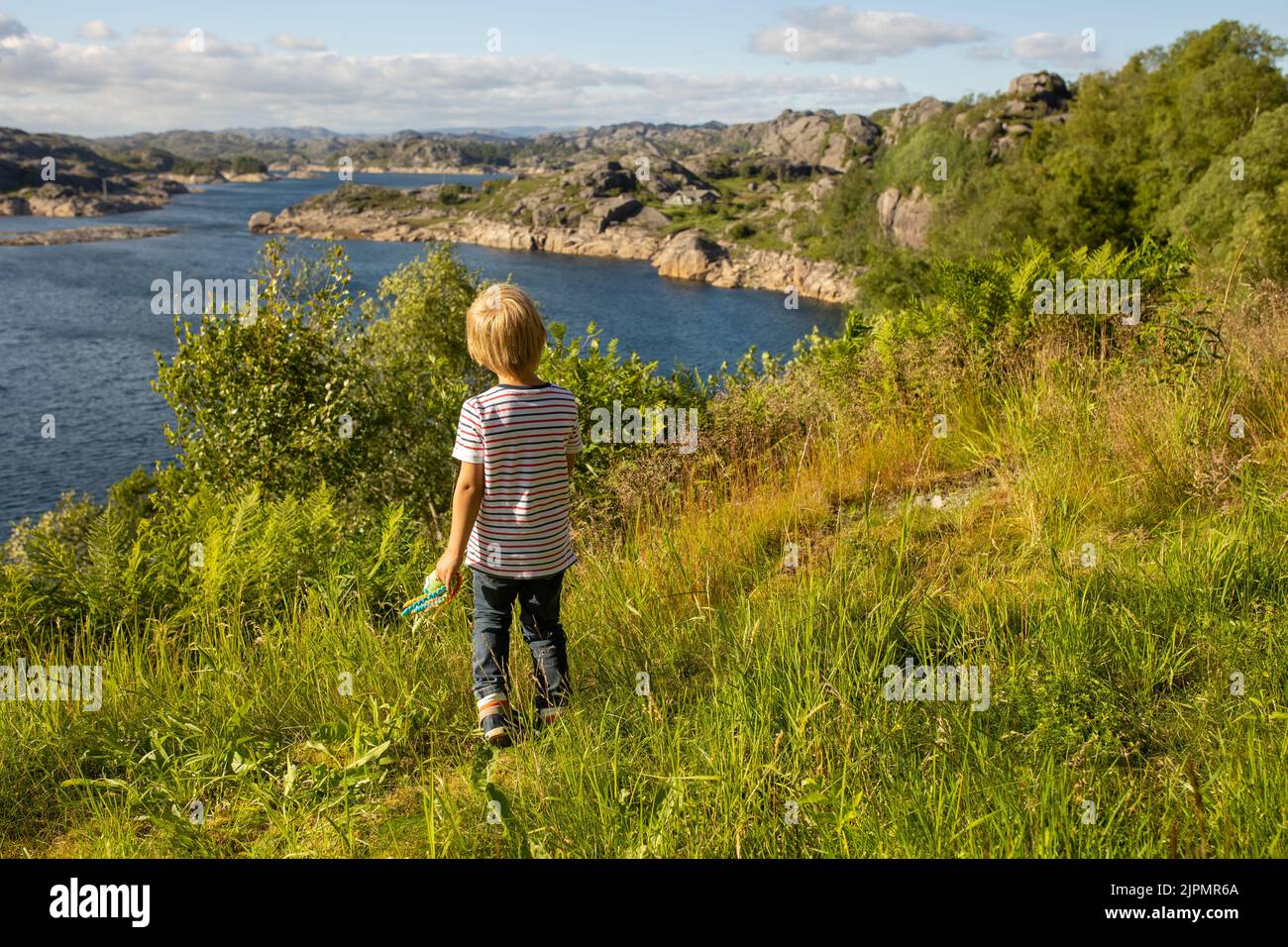 Happy people, enjoying amazing views in South Norway coastline, fjords ...