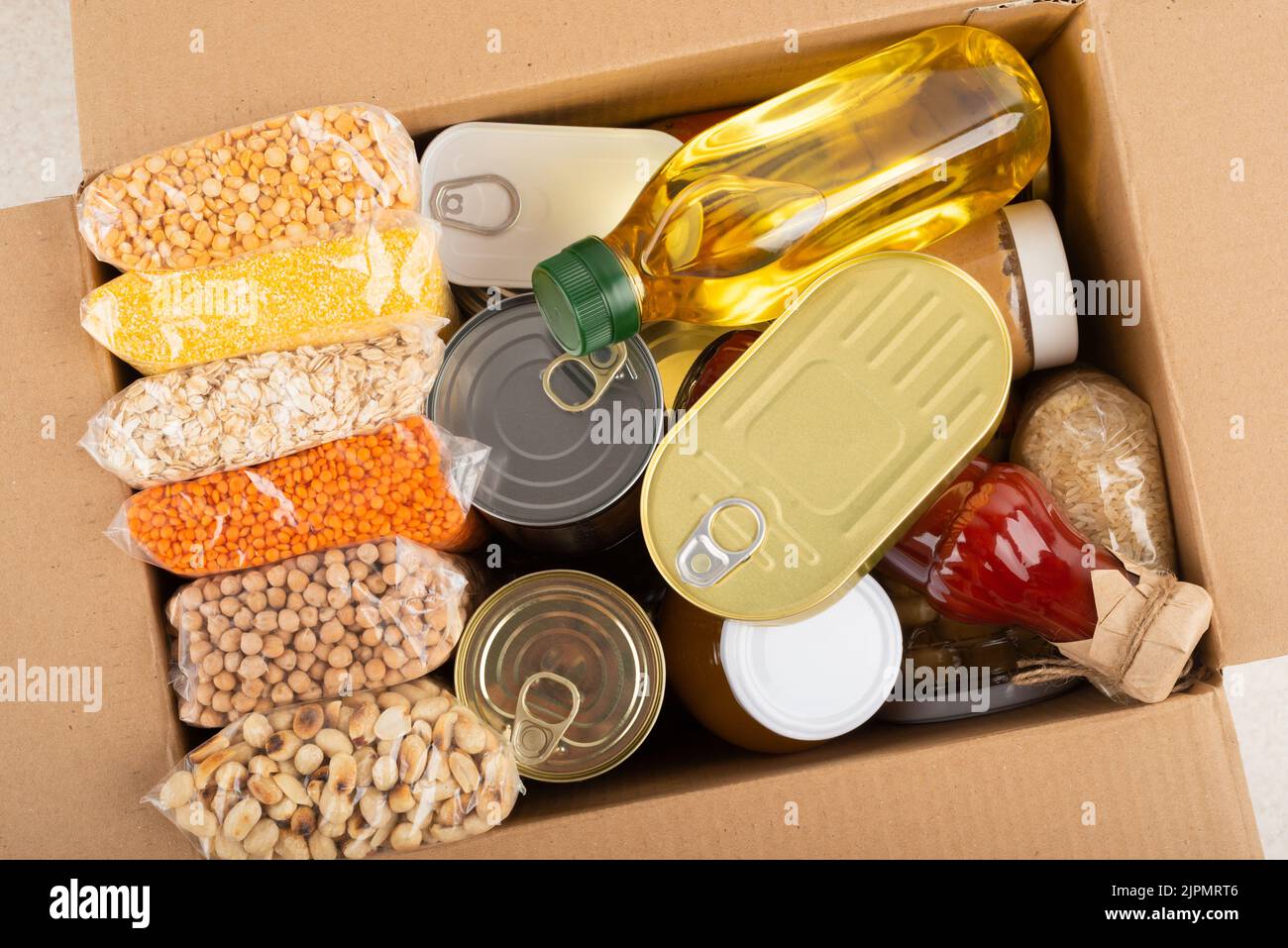 Survival set of nonperishable foods in carton box Stock Photo - Alamy
