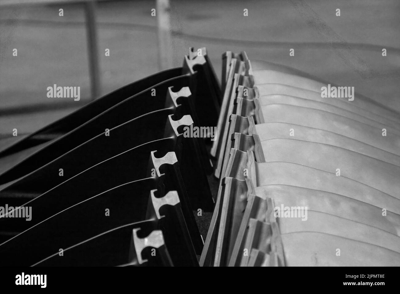 A grayscale of fan blades from a jet engine on a bench Stock Photo - Alamy