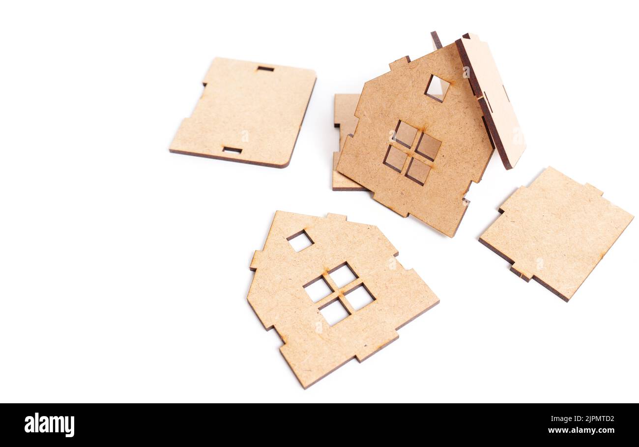 Self-assembly toy house parts scattered on white background ...