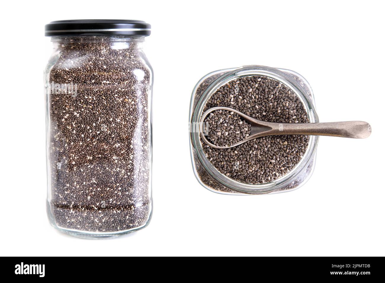 Side and top view of a glass jar of chia seeds with a steel spoon on ...