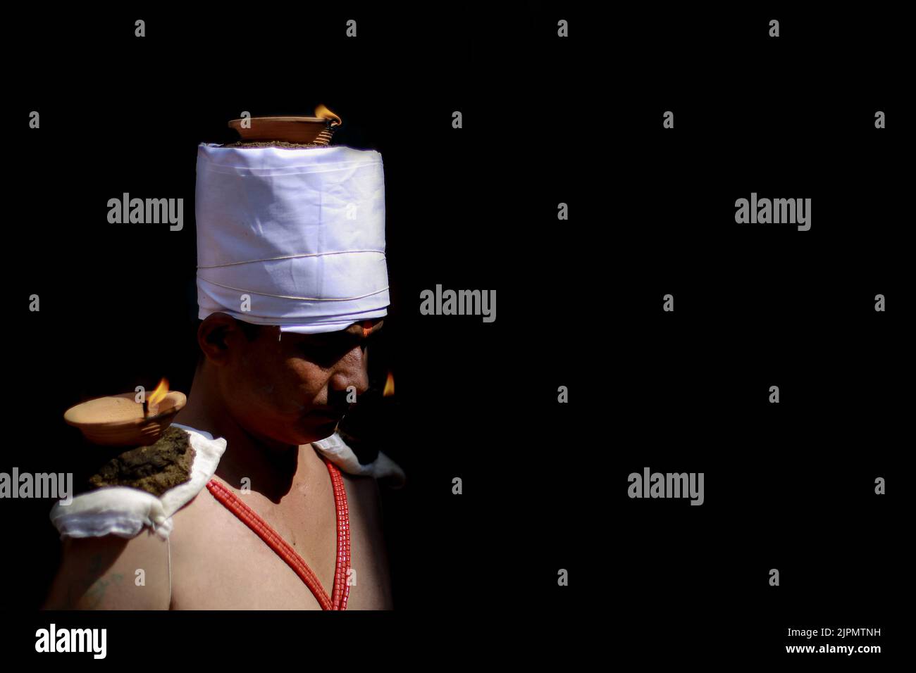 Bhaktapur, Bagmati, Nepal. 19th Aug, 2022. Devotees with lit oil lamps ...