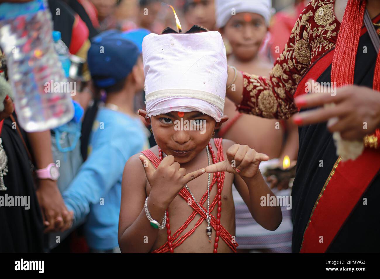 Bhaktapur, Bagmati, Nepal. 19th Aug, 2022. Devotees with lit oil lamps ...