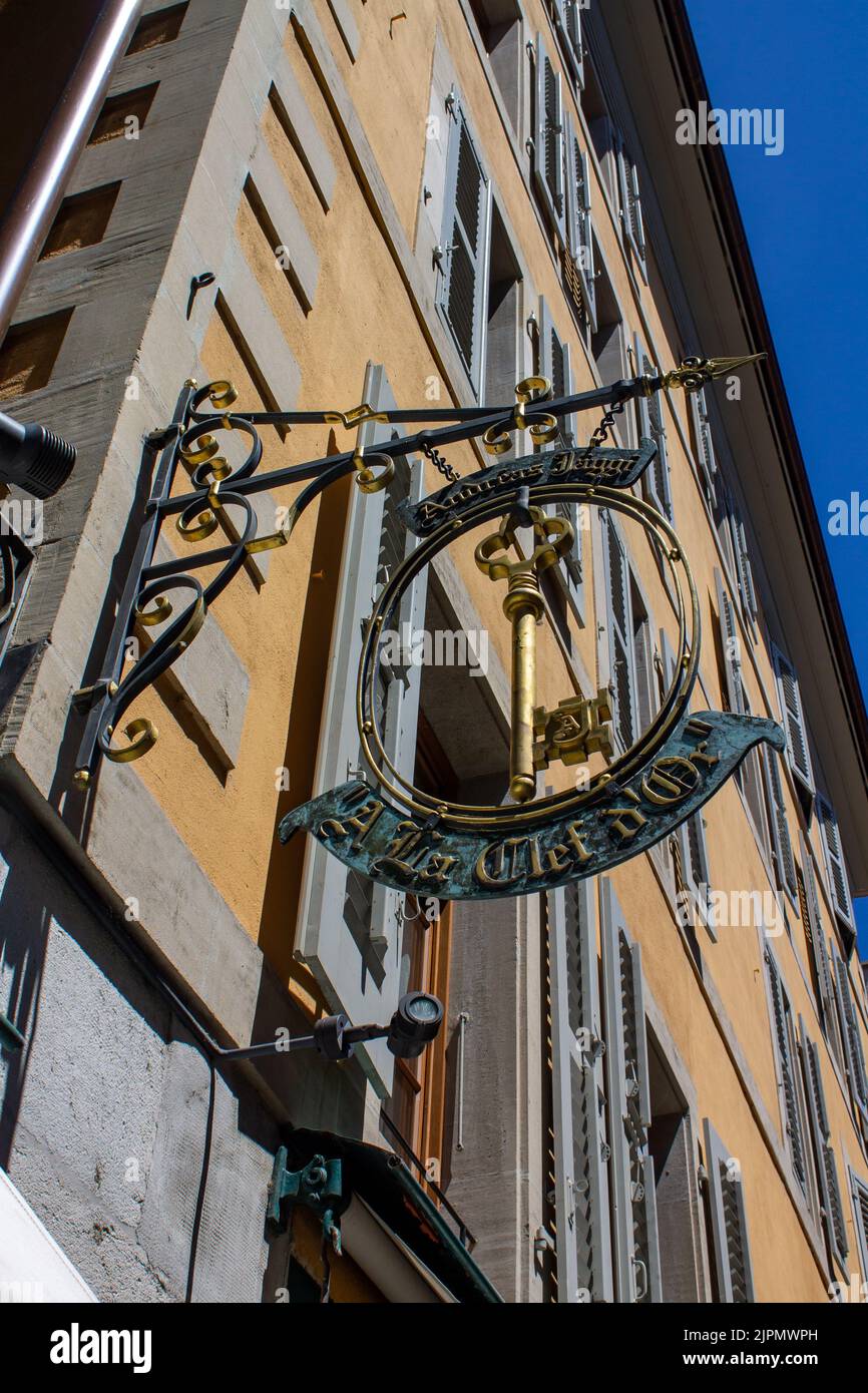 A vertical shot of a sign on the facade of a historical building in ...