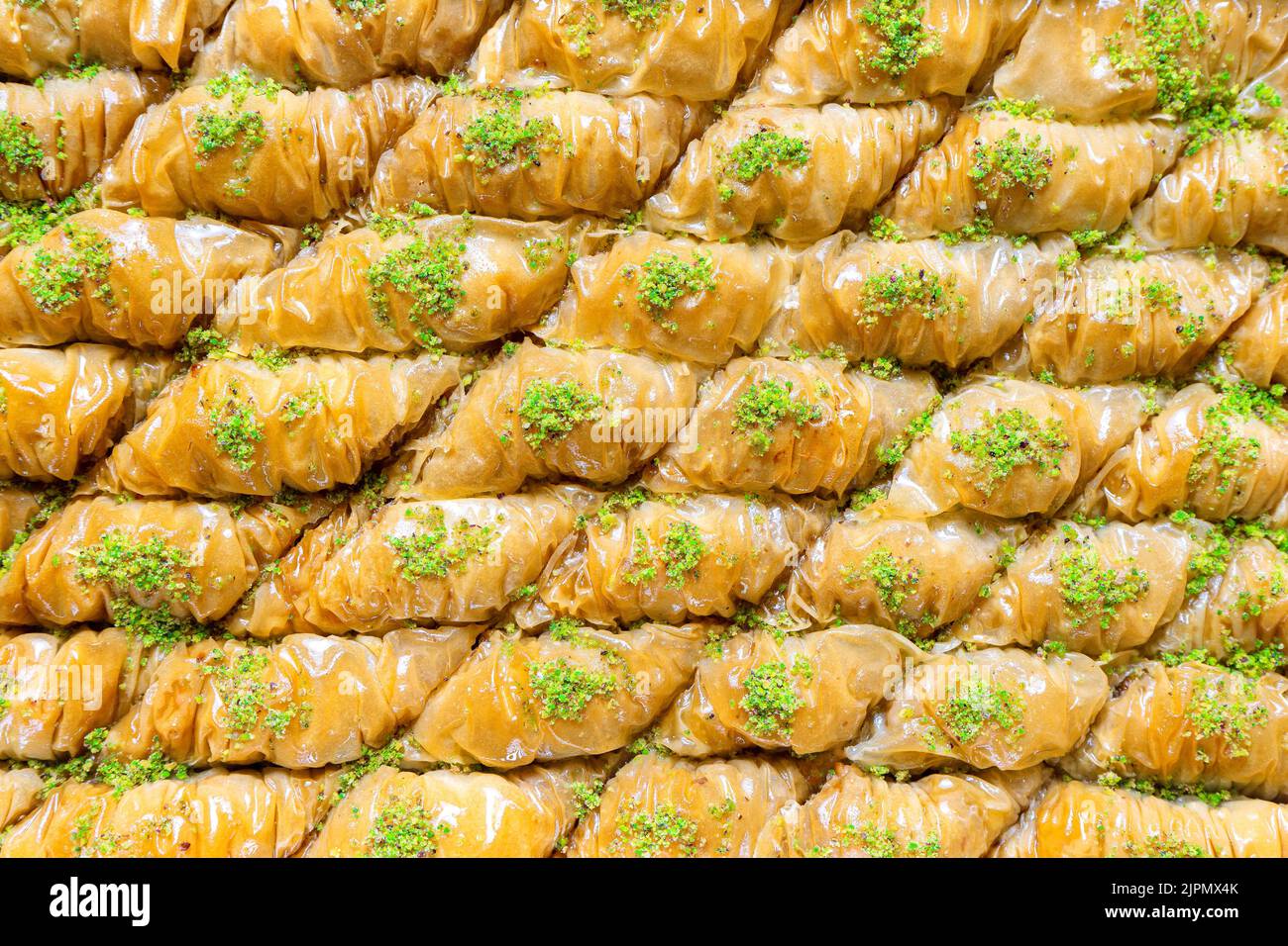 Slices of traditional pistachio turkish baklava background. Traditonal ...