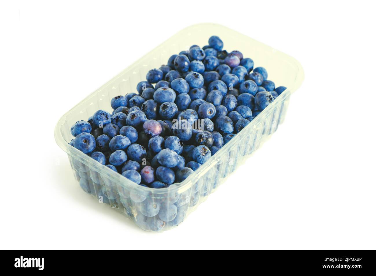 Fresh ripe organic blueberries in transparent plastic box isolated on ...