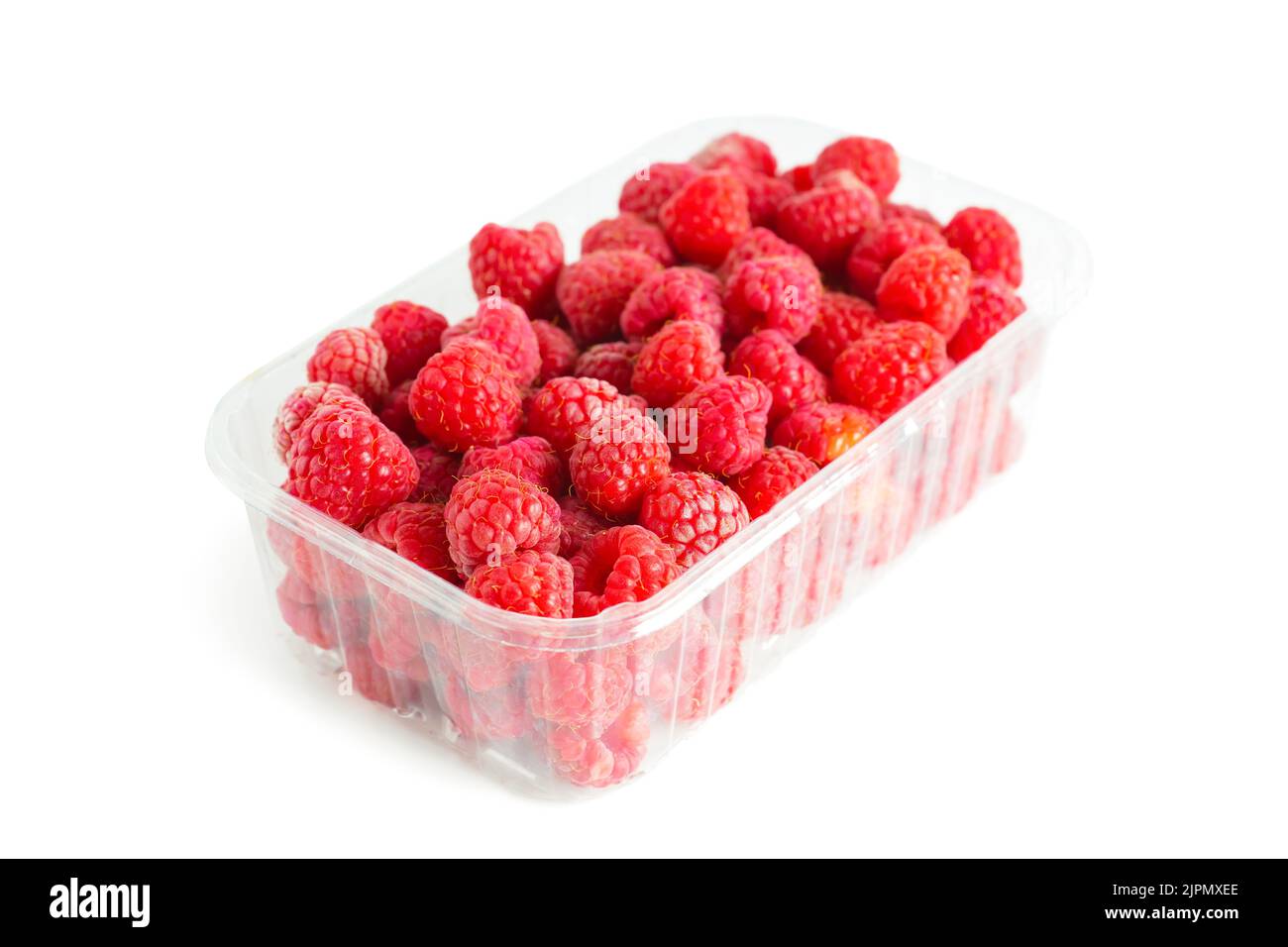 Fresh ripe organic red raspberries in transparent plastic box isolated ...