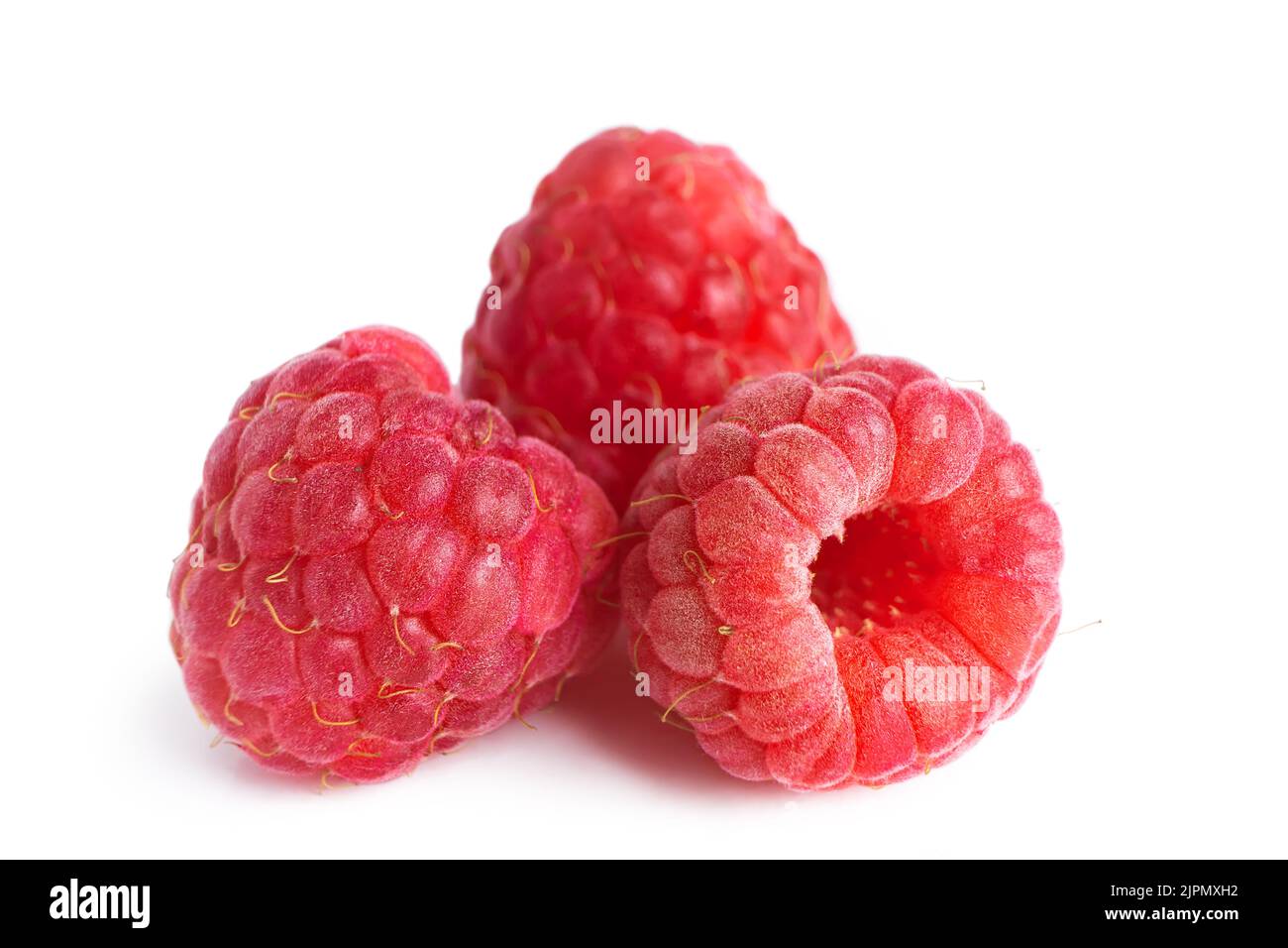 Three fresh red organic raspberries isolated on white background Stock ...