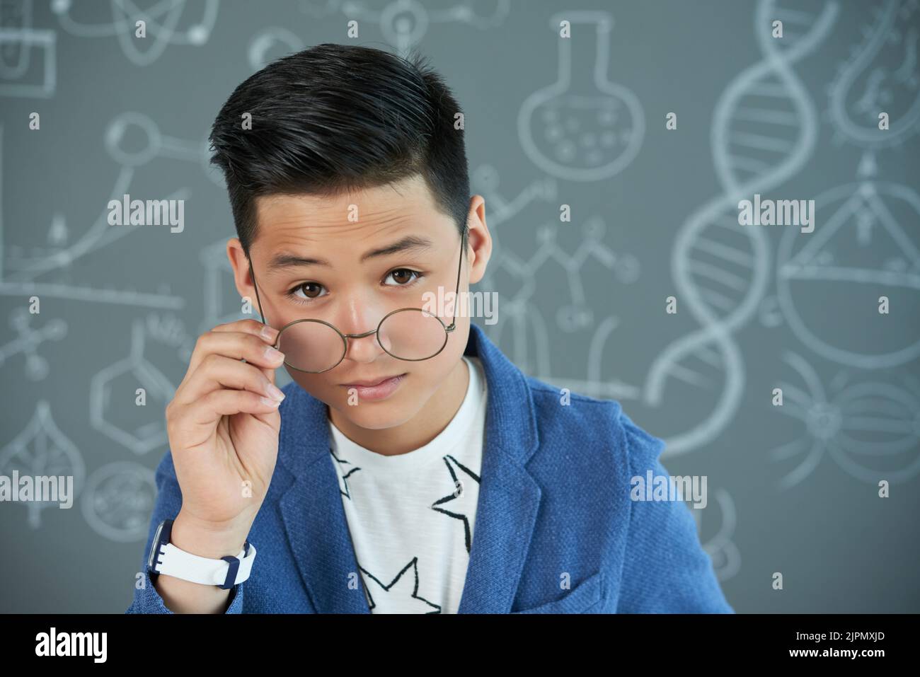 Head and shoulders portrait of cute teenage student wearing eyeglasses ...