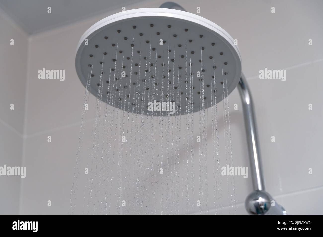 Close up rain shower with running water in a bright bathroom Stock ...