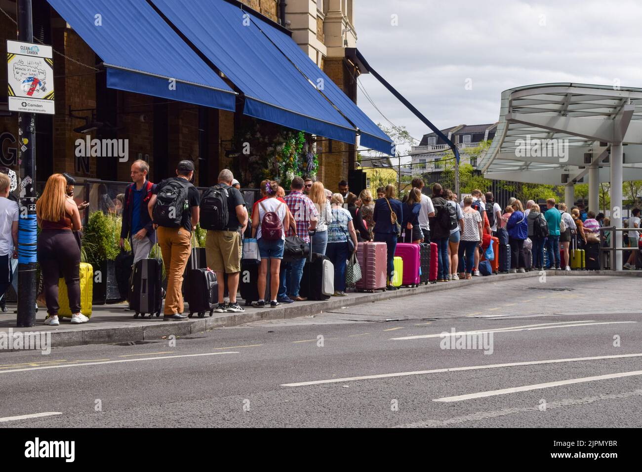 London, UK. 19th Aug, 2022. A huge queue forms at a taxi rank outside ...