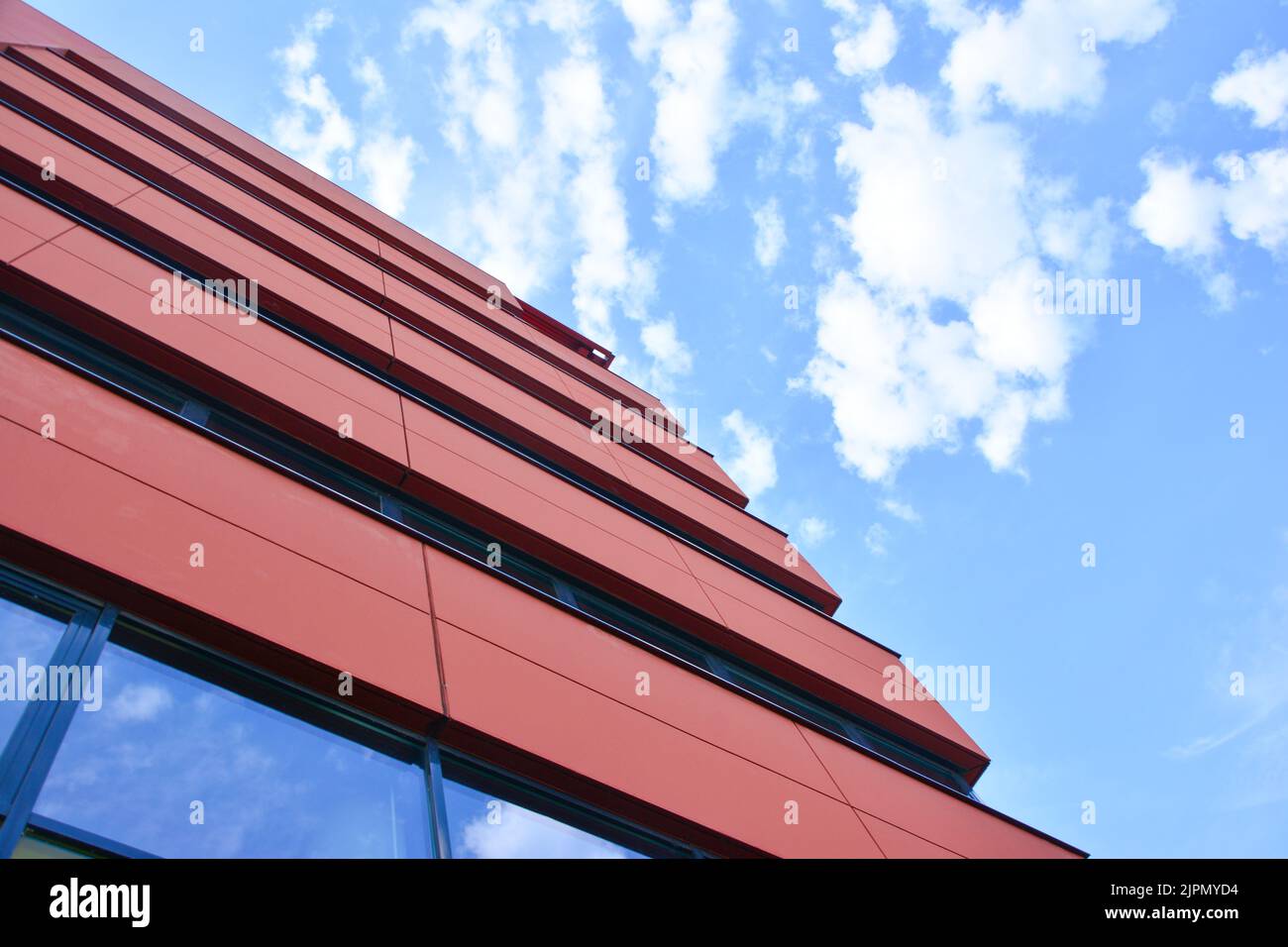 Modern red building with offices and glass windows Stock Photo - Alamy