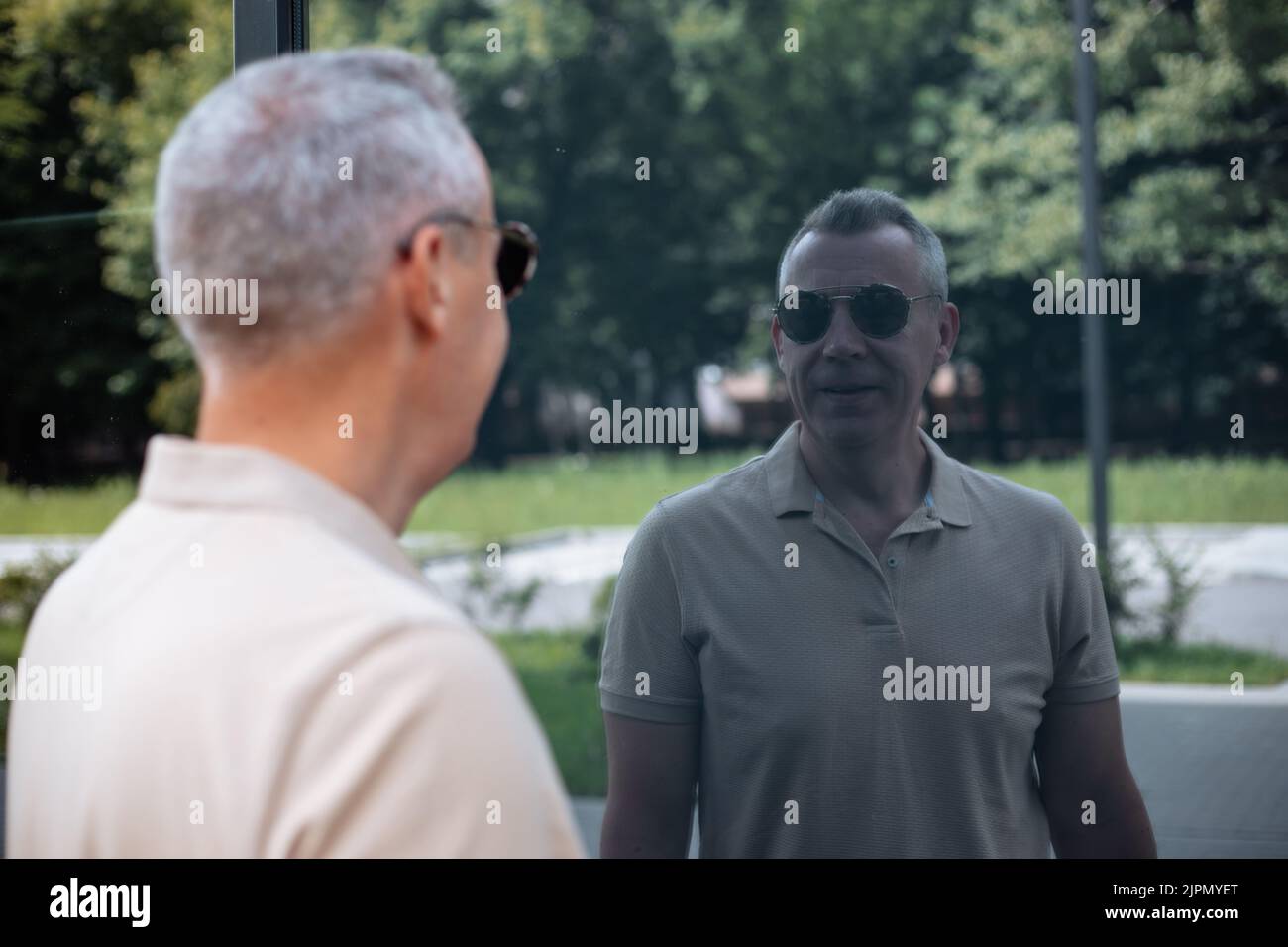 Elderly man standing outside hi-res stock photography and images - Alamy