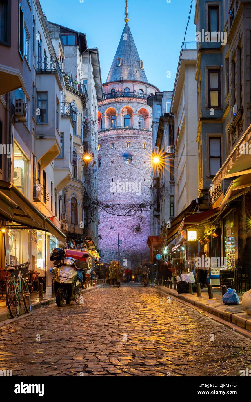 A vertical shot of Galata Tower at night in Istanbul Stock Photo - Alamy