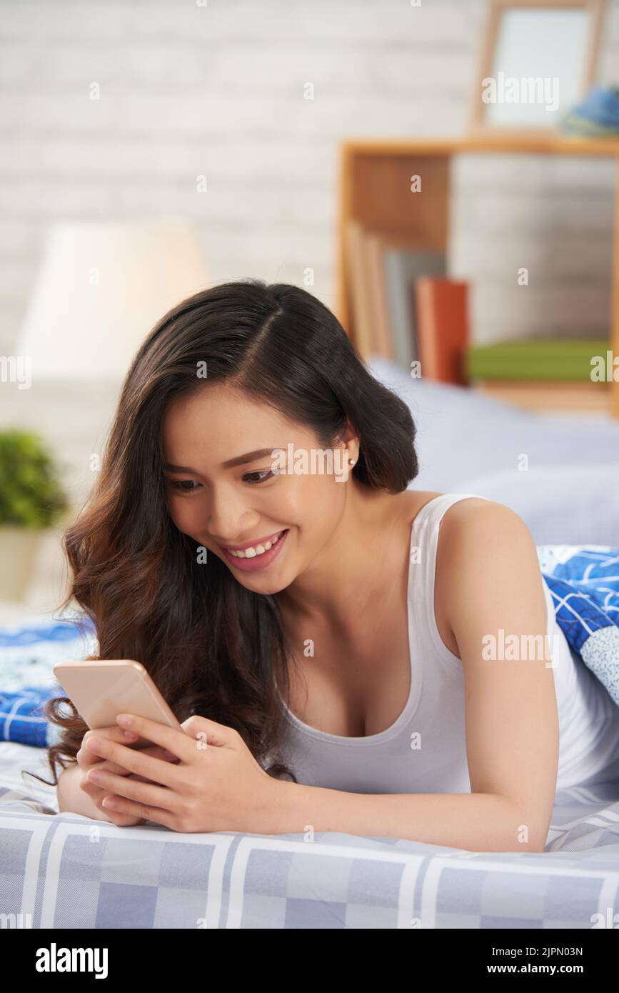Lovely young asian woman texting hi-res stock photography and images ...