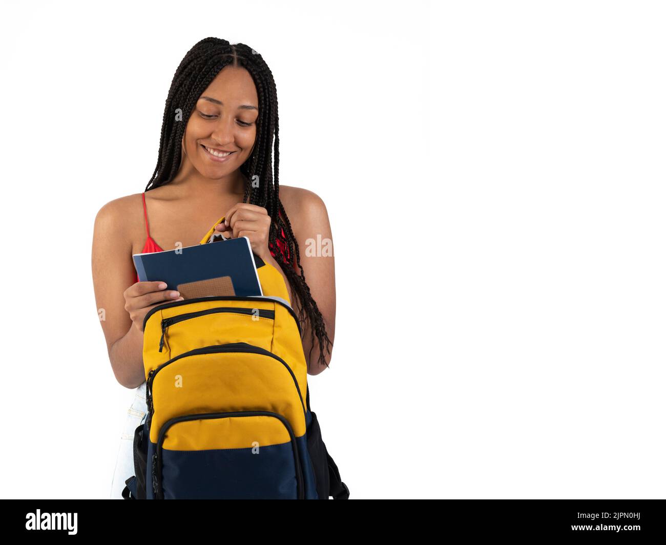 Young black student with her bag and notebooks on a white background ...