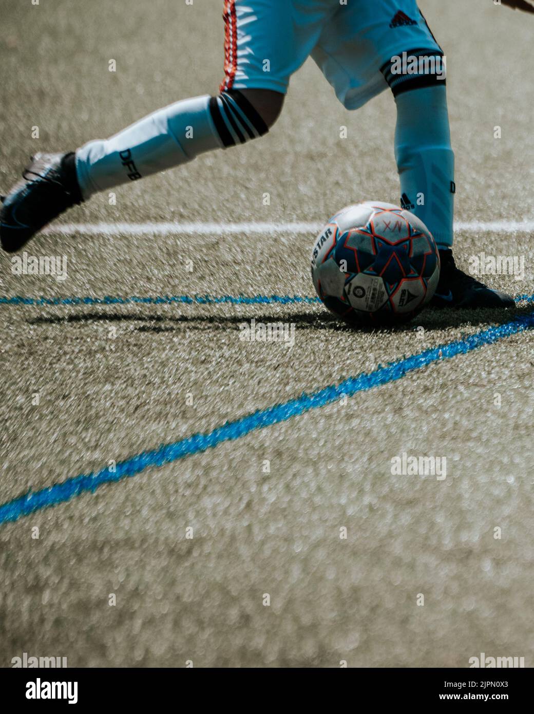Kids passing soccer ball hi-res stock photography and images - Alamy