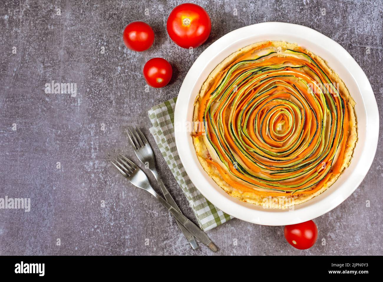 Homemade spiral vegetable tart pie of carrots, zucchini and eggplant ...